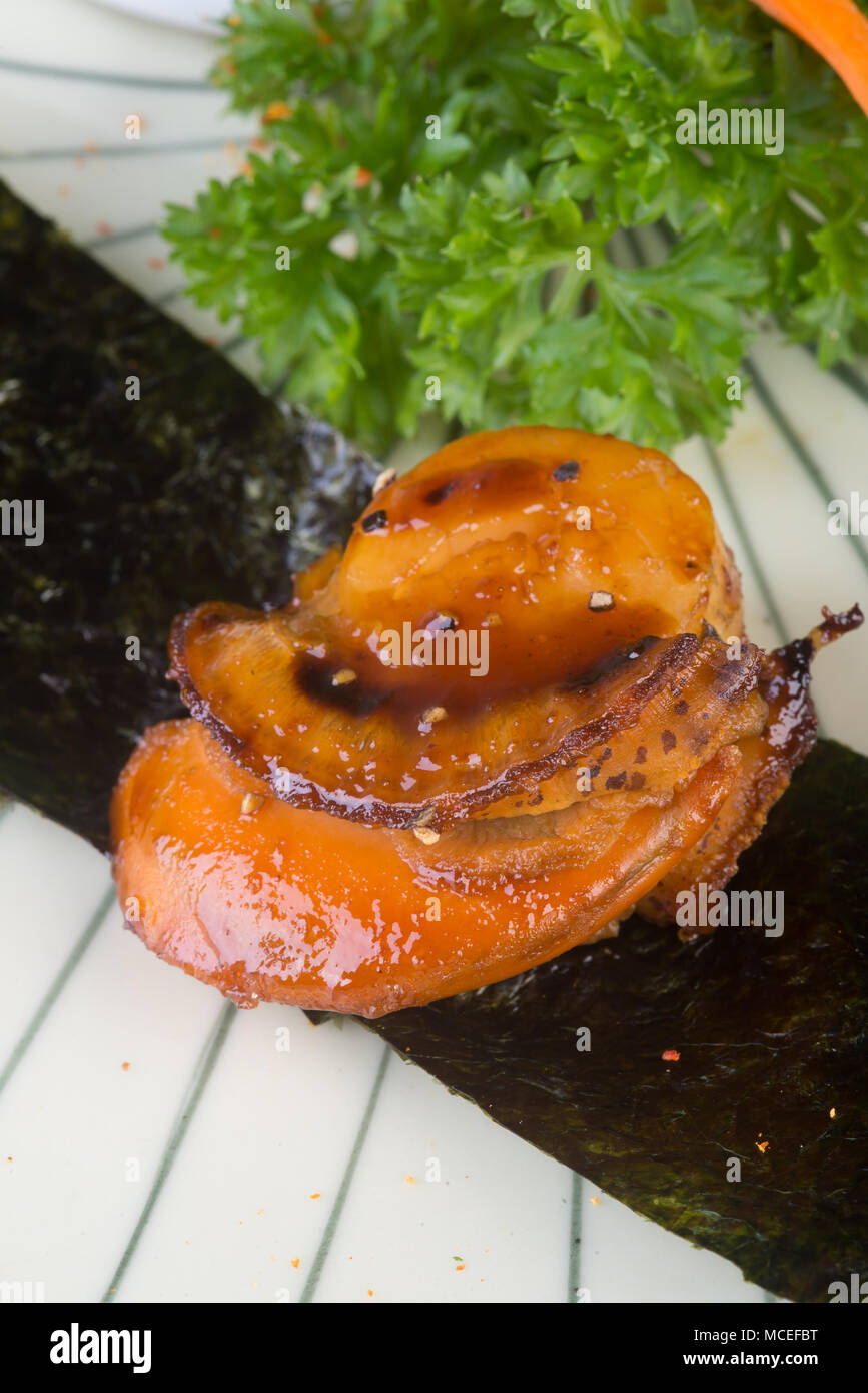 japanese cuisine. grilled shell fish on background Stock Photo - Alamy