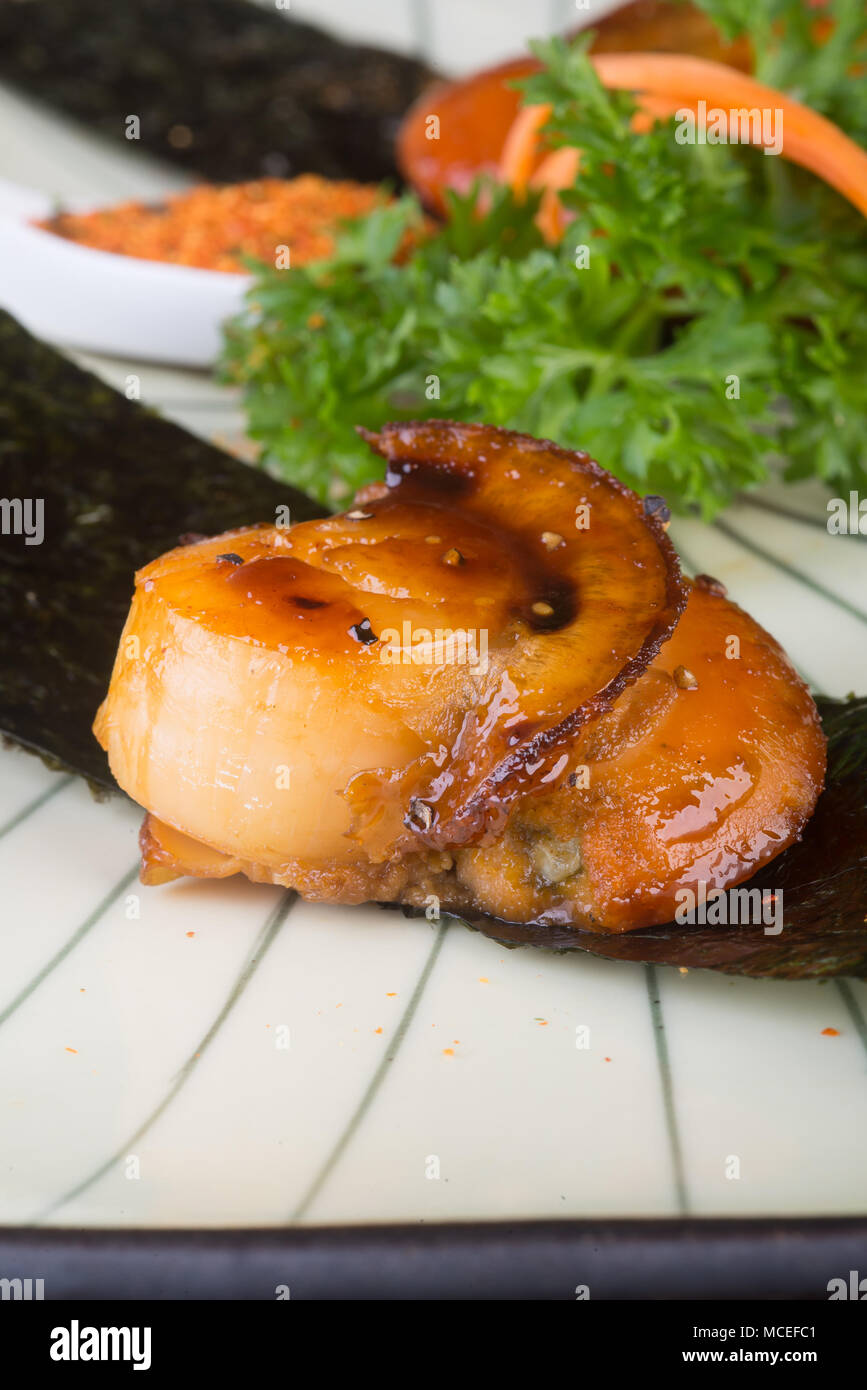 japanese cuisine. grilled shell fish on background Stock Photo - Alamy