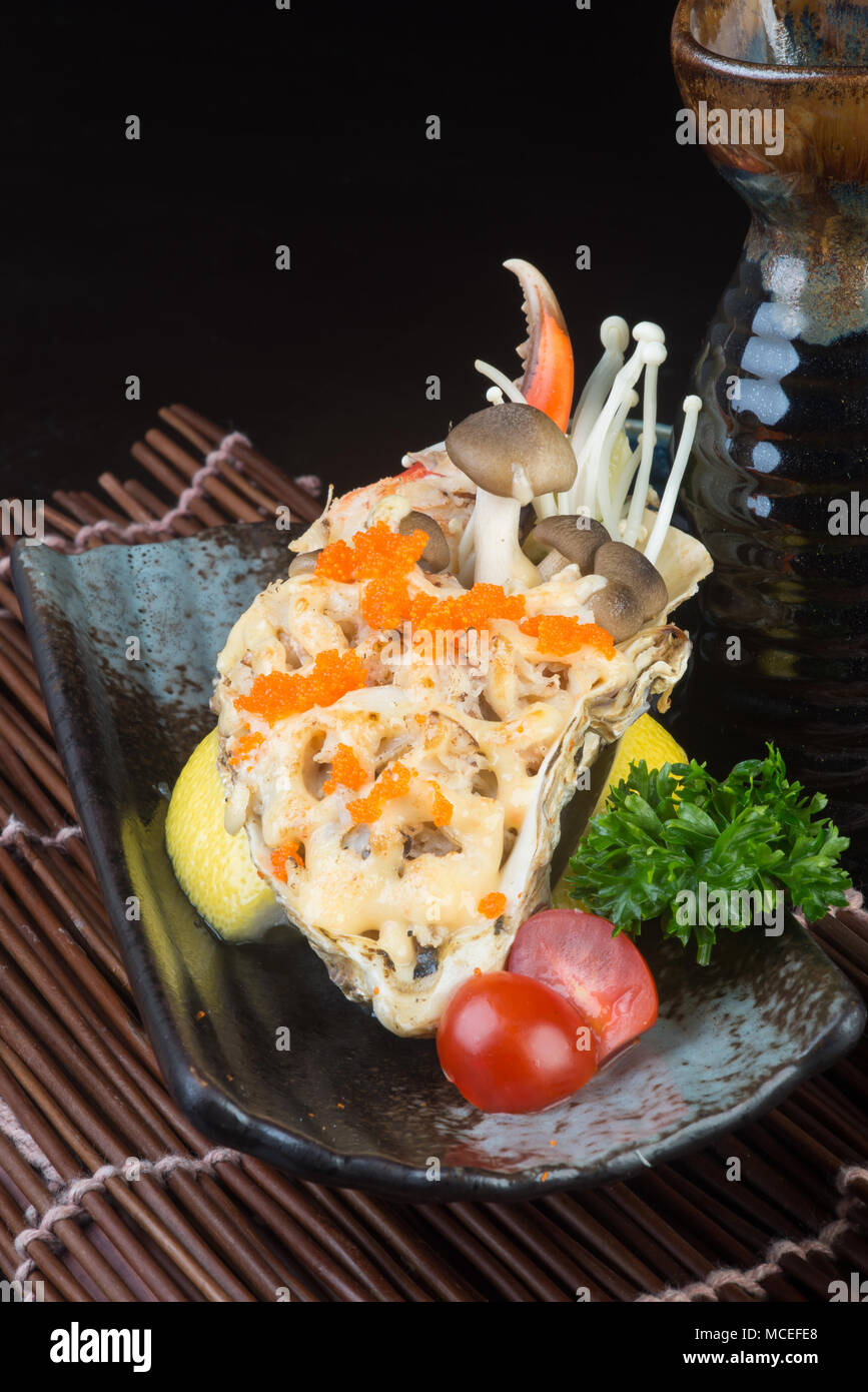 japanese cuisine. grilled shell fish on background Stock Photo - Alamy