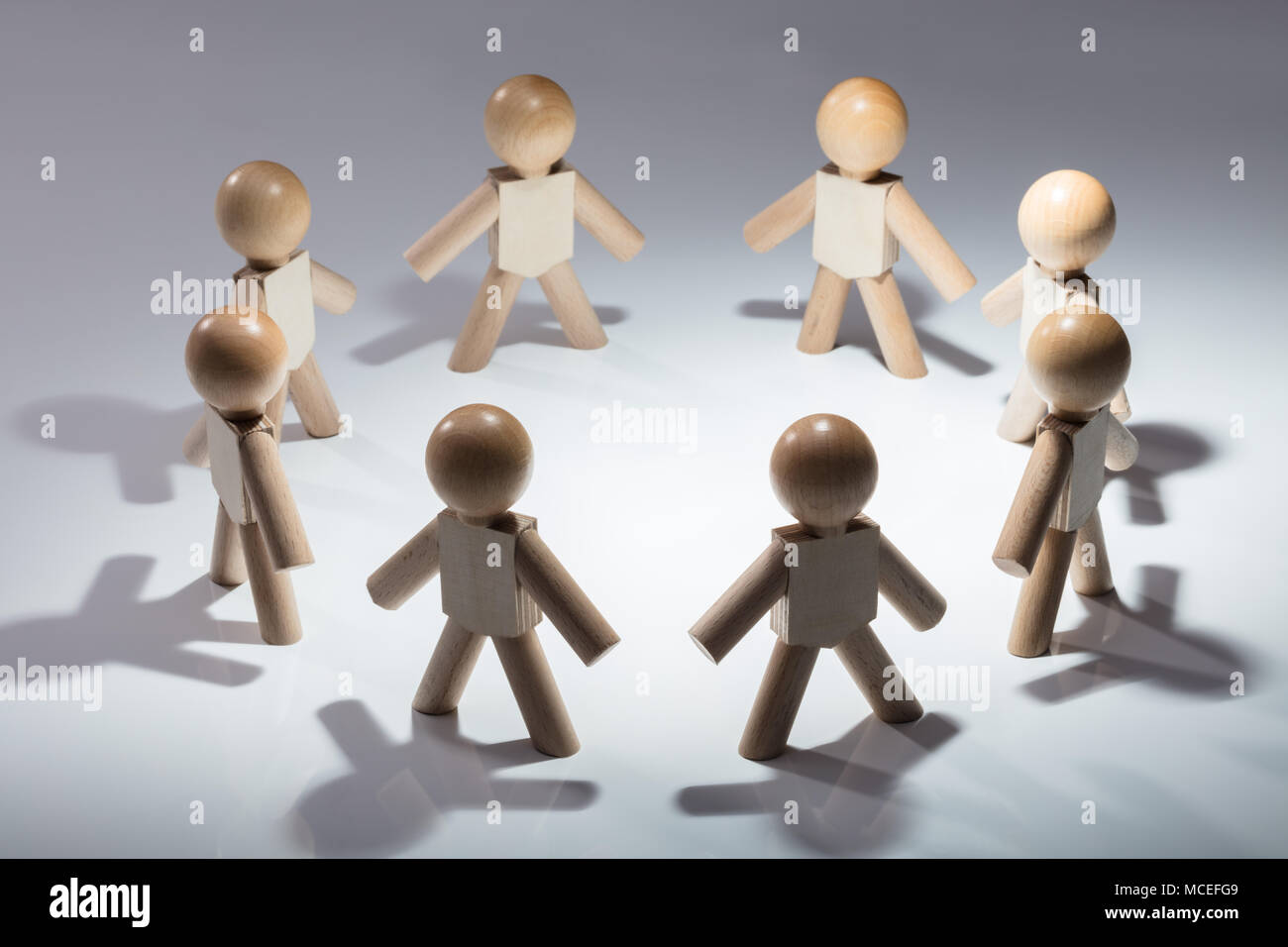 Wooden Human Figures Forming Circle Standing On White Background Stock ...