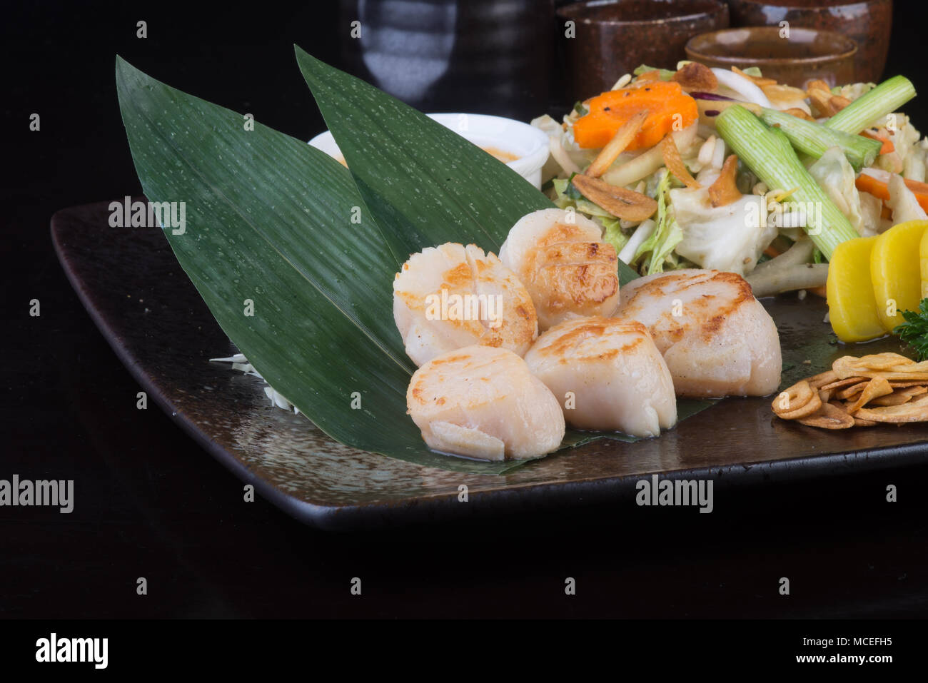 japanese cuisine. grilled shell fish on background Stock Photo - Alamy