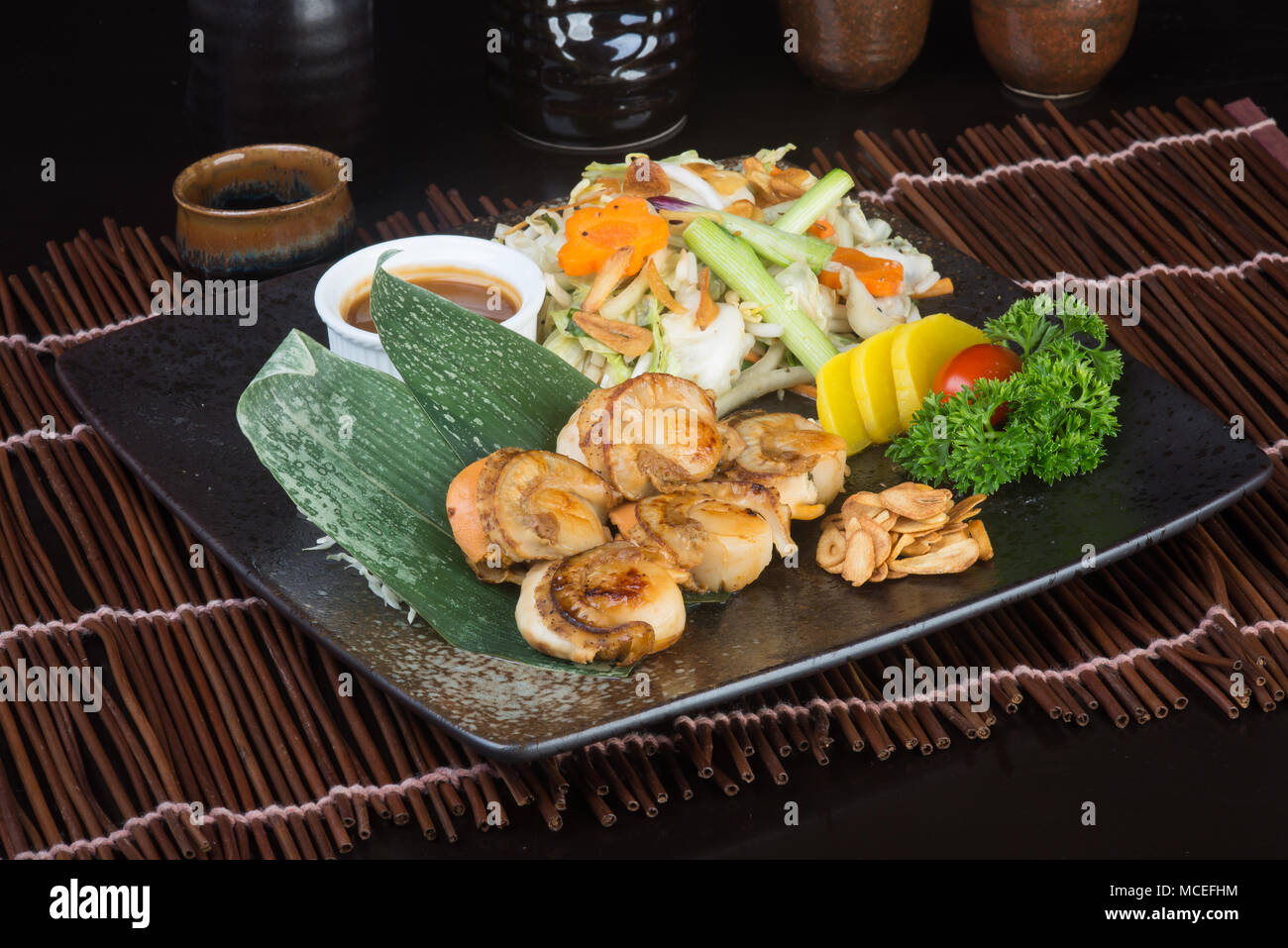 japanese cuisine. grilled shell fish on background Stock Photo - Alamy