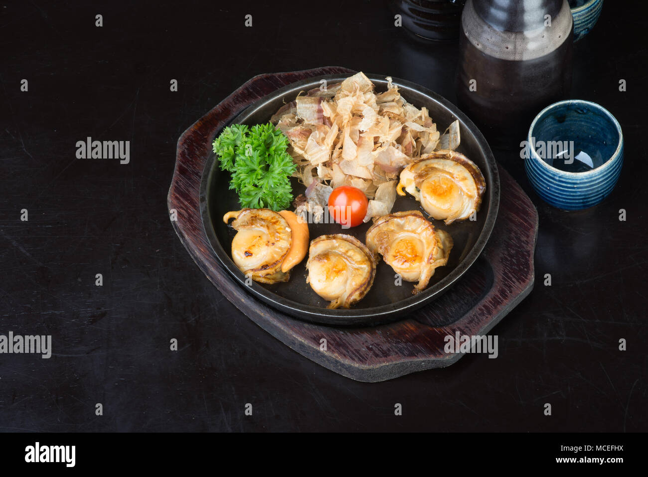 japanese cuisine. grilled shell fish on background Stock Photo - Alamy