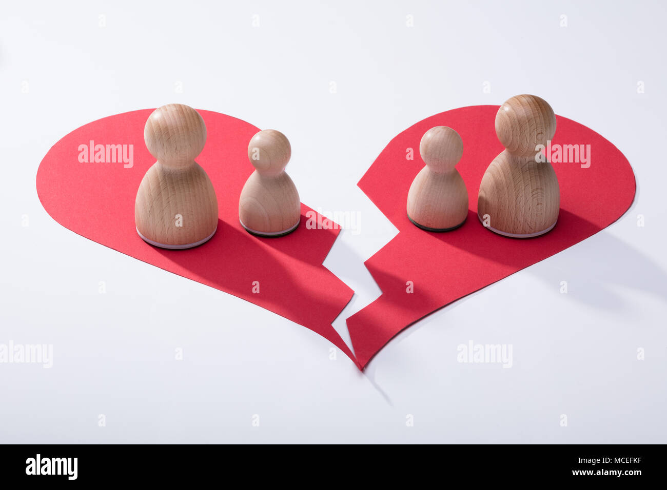Closeup of a broken figurine on wooden floor Stock Photo - Alamy