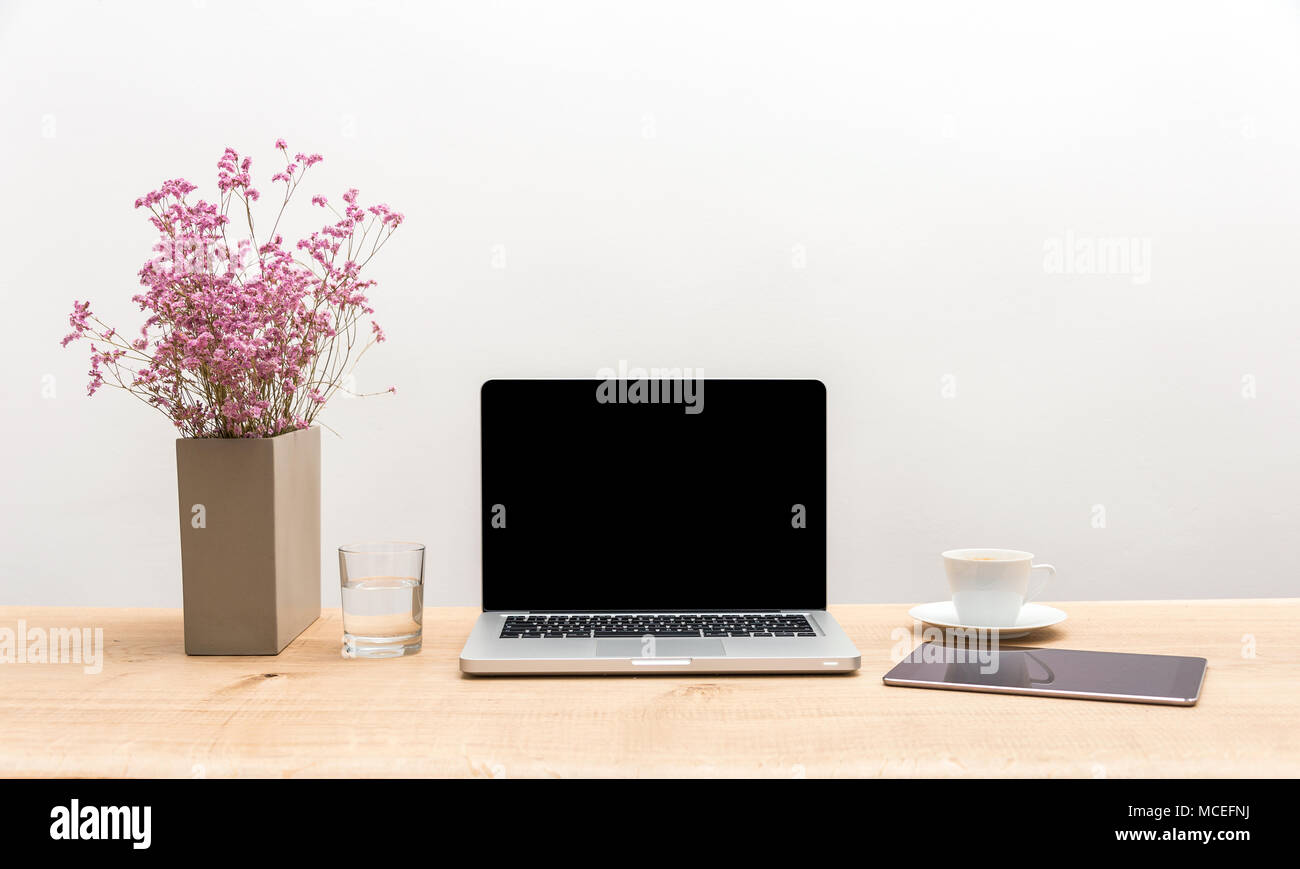 Blank black laptop screen and tablet with copy space for writing a ...