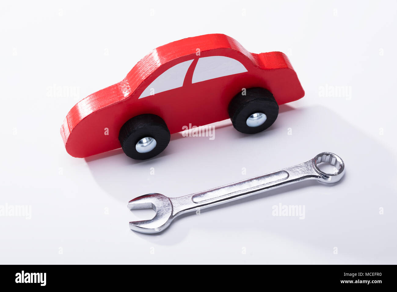Elevated View Of Red Car And Wrench Isolated On White Background Stock ...