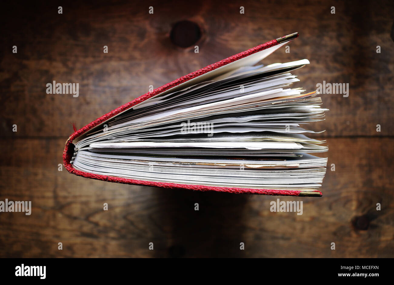 Old vintage looking notebook close up against a wooden background Stock ...