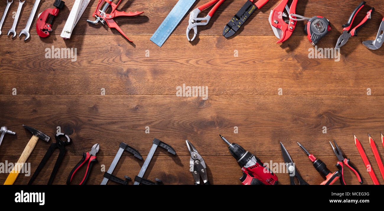 High Angle View Of Various Worktools In A Row On Wooden Desk Stock ...