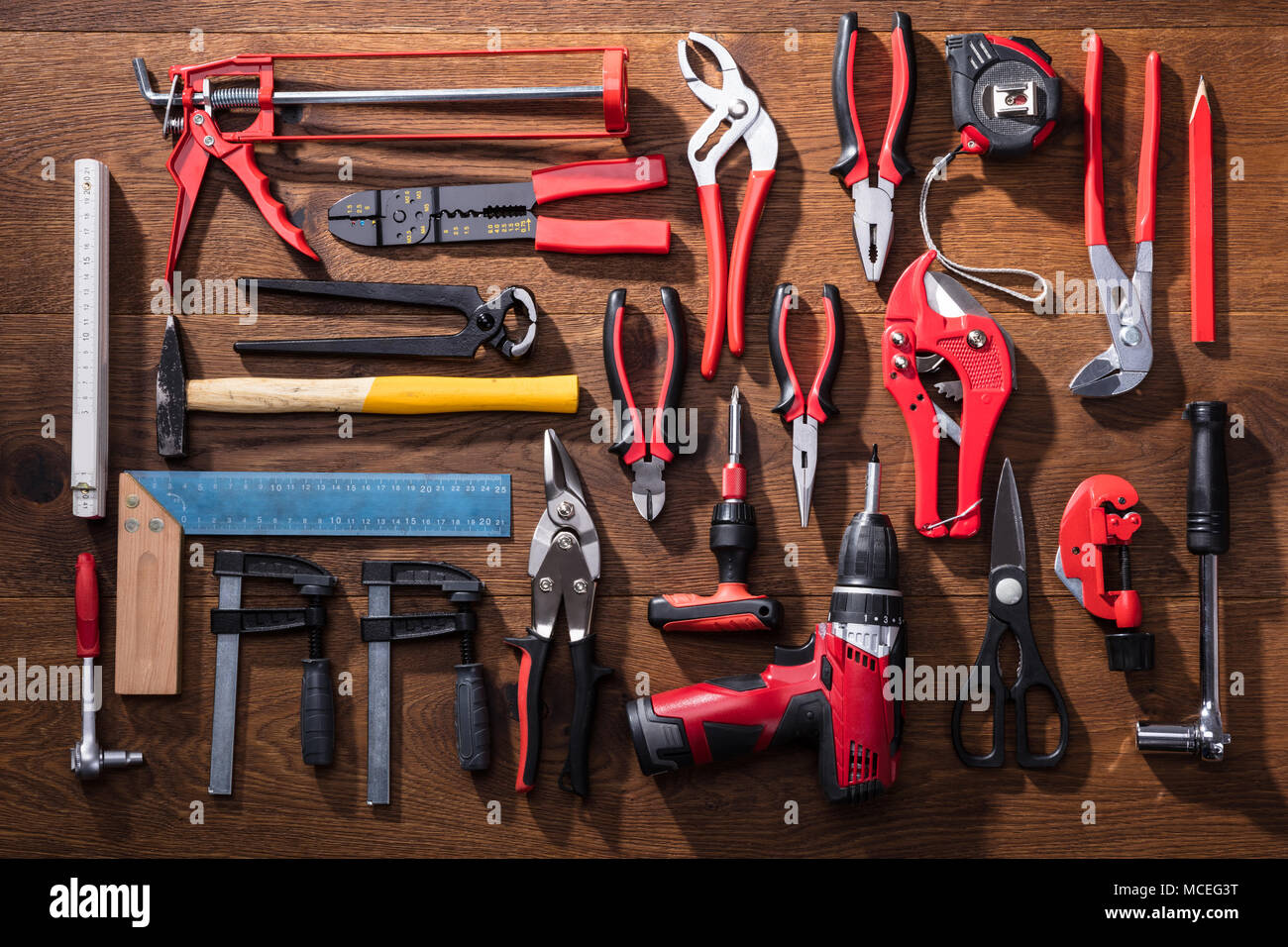 Elevated View Of Various Worktools On Wooden Desk Stock Photo - Alamy