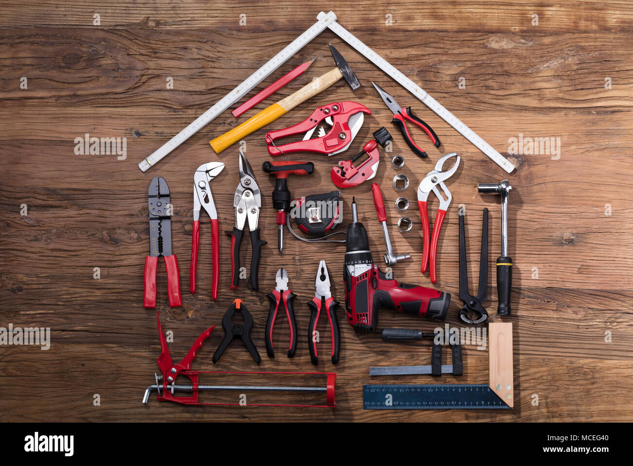 Elevated View Of Various Worktools On Wooden Desk Stock Photo - Alamy