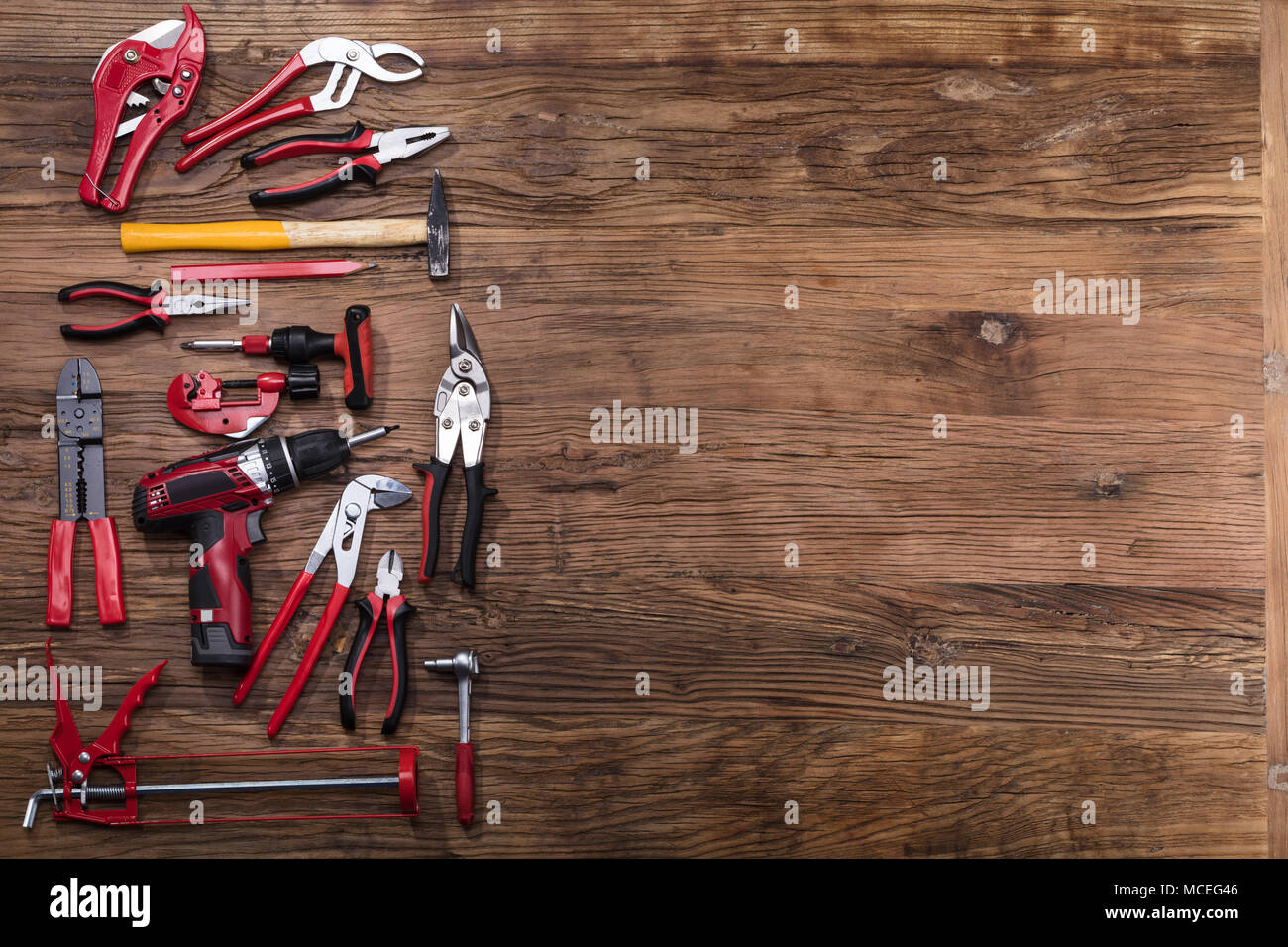 Elevated View Of Various Worktools On Wooden Desk Stock Photo - Alamy