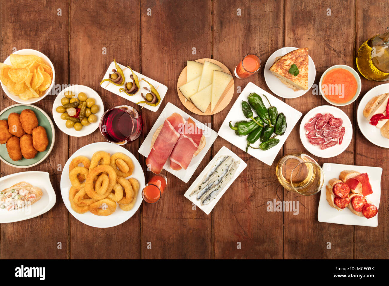An overhead photo of an assortment of Spanish tapas food, shot from the ...
