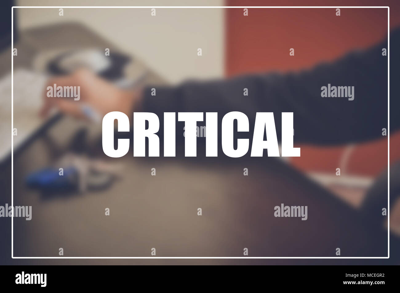 Critical word with business blurring background Stock Photo - Alamy