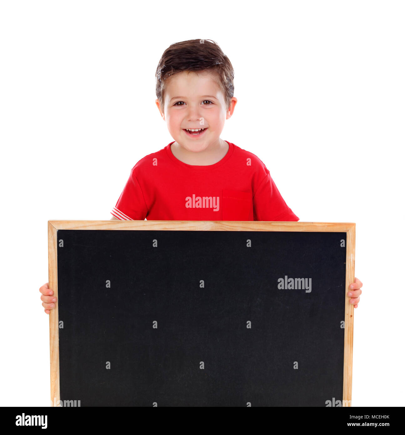 Happy child holding a blank slate isolated on a white background Stock ...