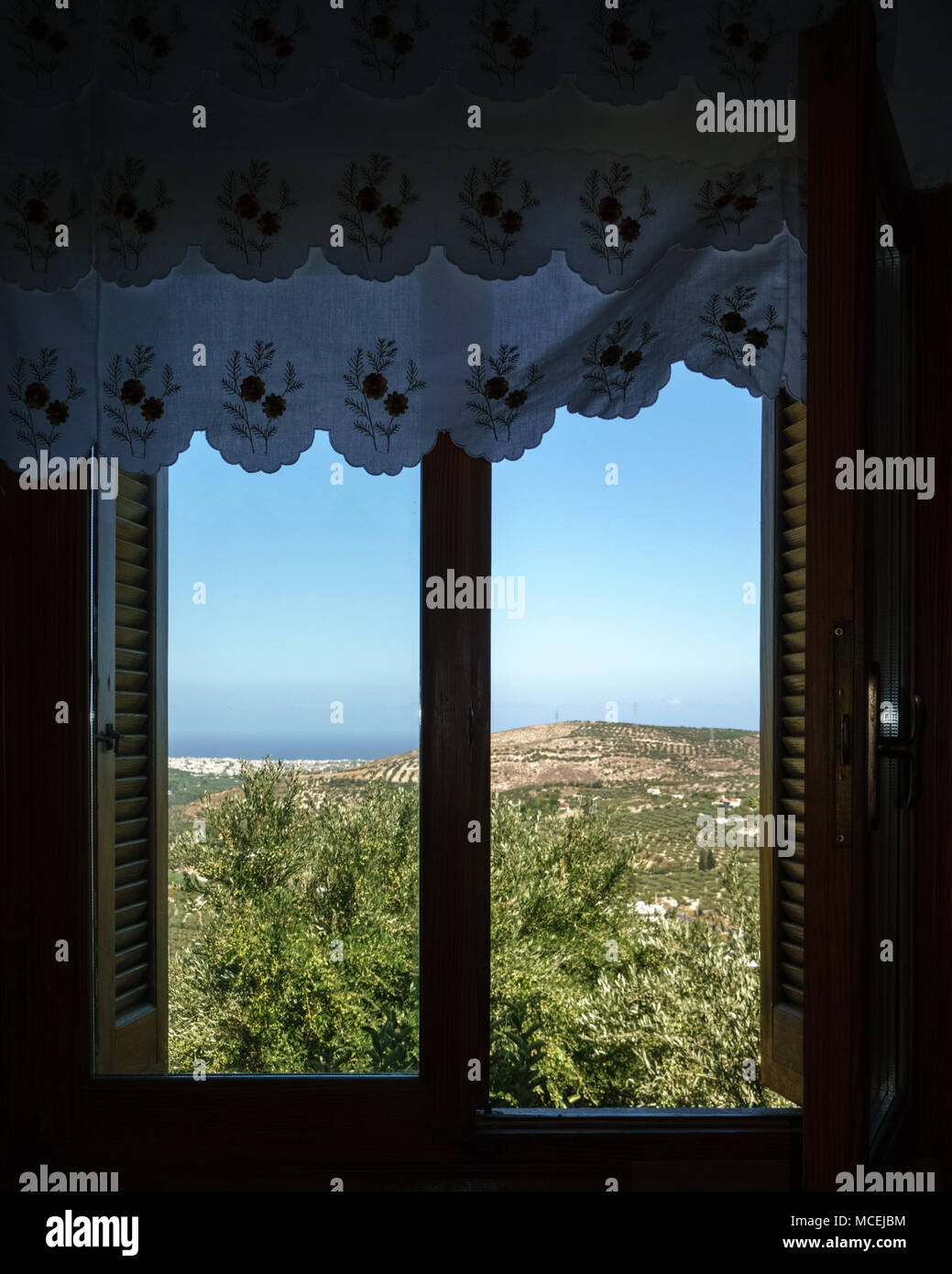 Scenic view of field and sky from window, Crete, Greece Stock Photo - Alamy