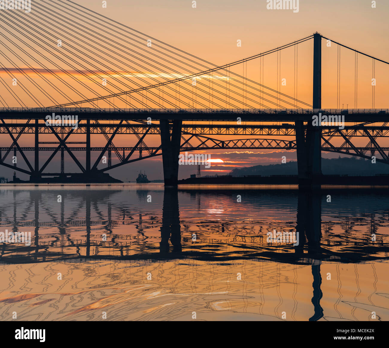 Sunrise view of the three major bridges crossing the Firth of Forth at ...