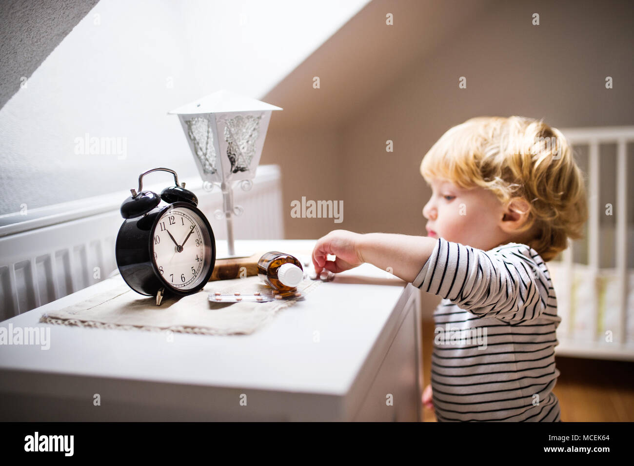 Toddler boy in a dangerous situation at home Stock Photo - Alamy
