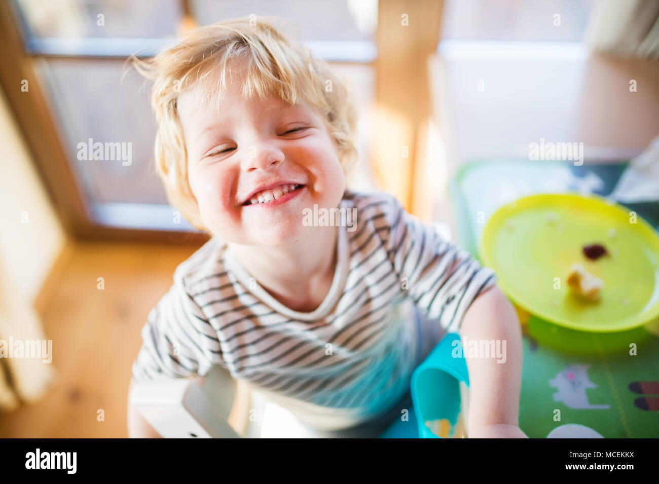 A toddler boy eating at home Stock Photo - Alamy