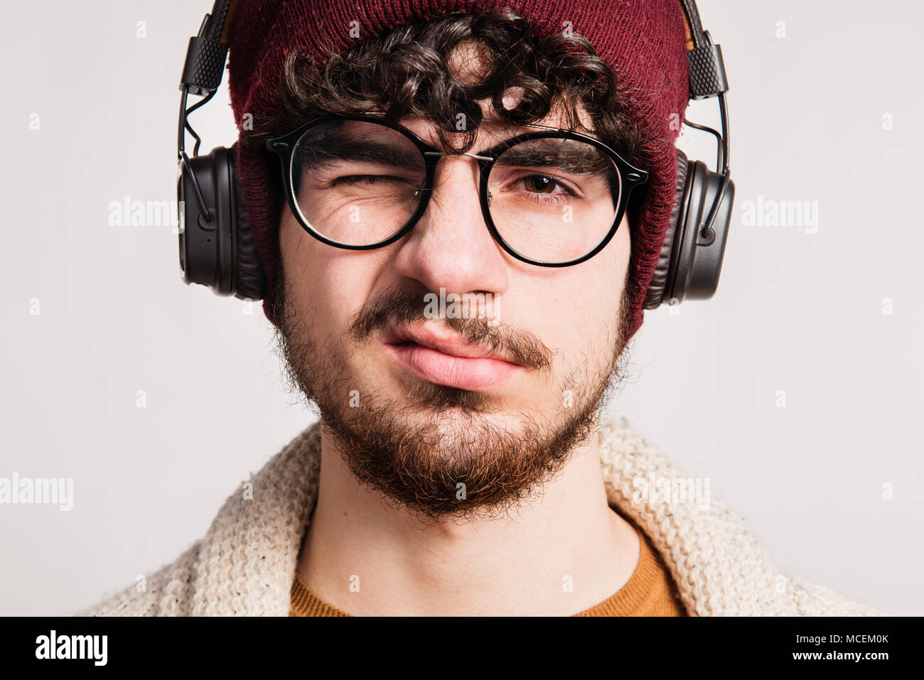 Portrait of a young man with headphones in a studio Stock Photo - Alamy