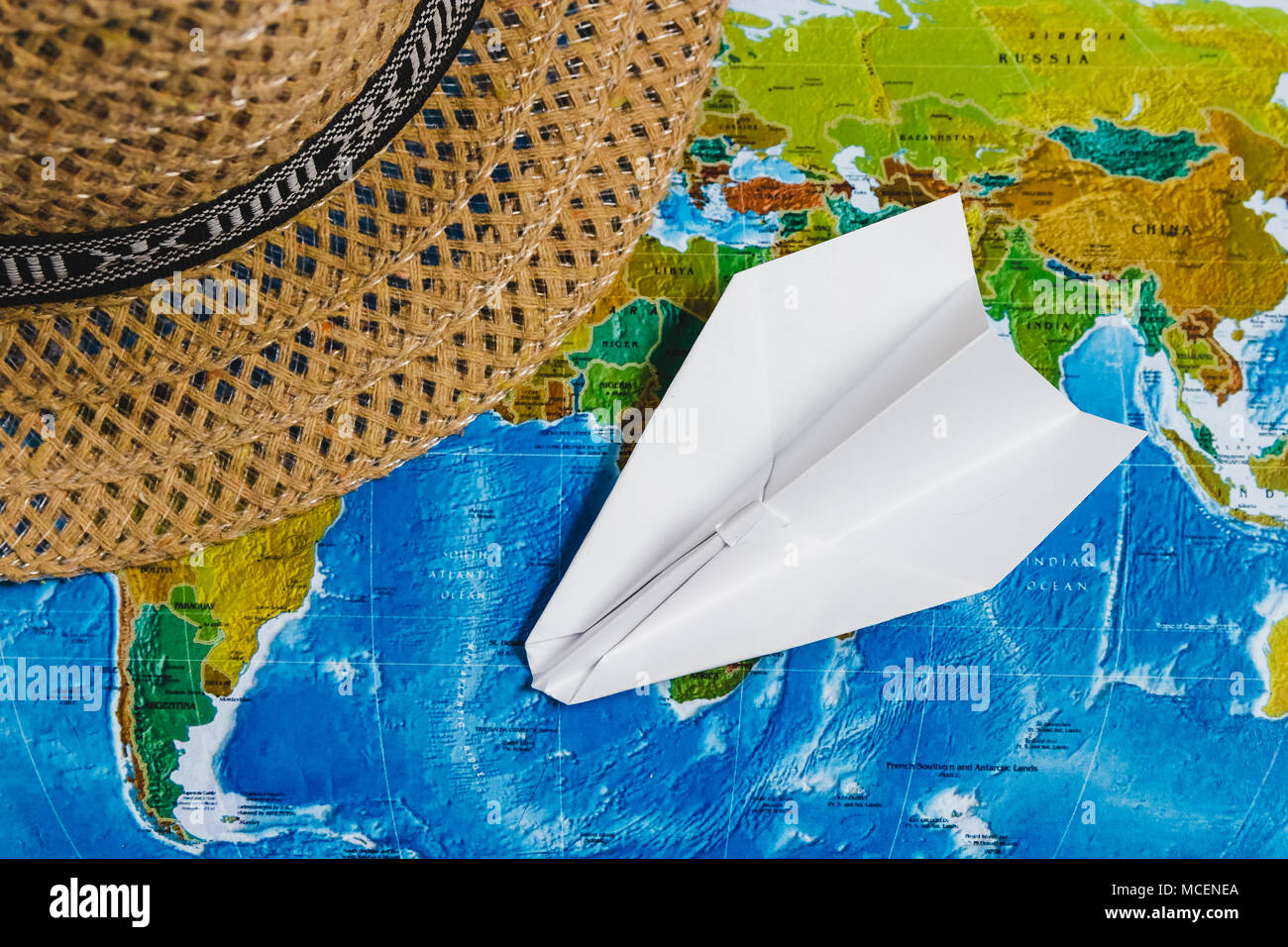 Adventure. Papercraft Plane, Hat on map. Top view Travel Concept Stock ...