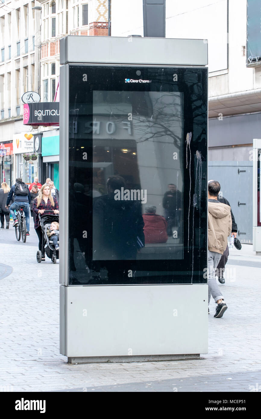 a blank clear channel advertising screen on the city centre high street ...