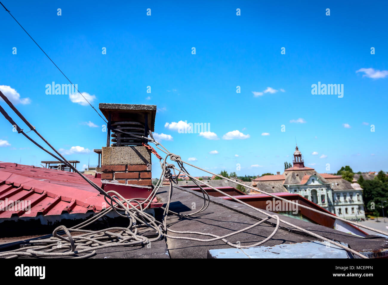 Tied ropes of industrial climbers around chimney made of bricks Stock ...