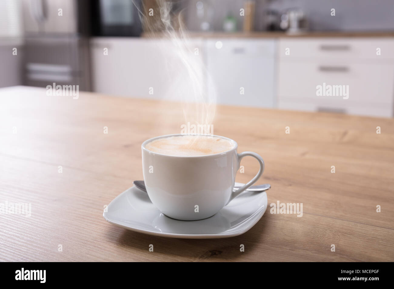Close-up Of Hot Coffee On Wooden Desk Stock Photo - Alamy