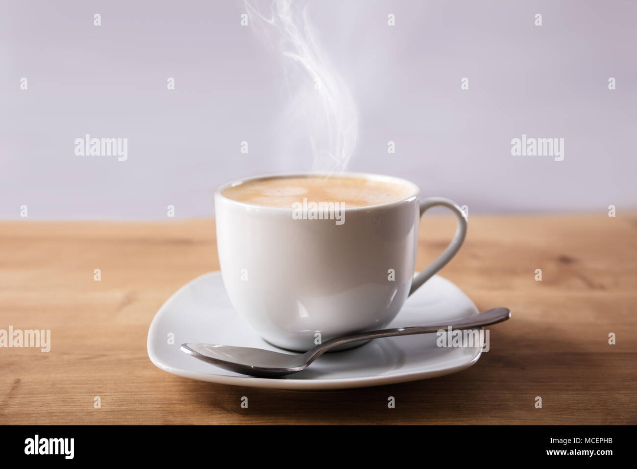 Elevated View Of Hot Coffee On Wooden Desk Stock Photo - Alamy