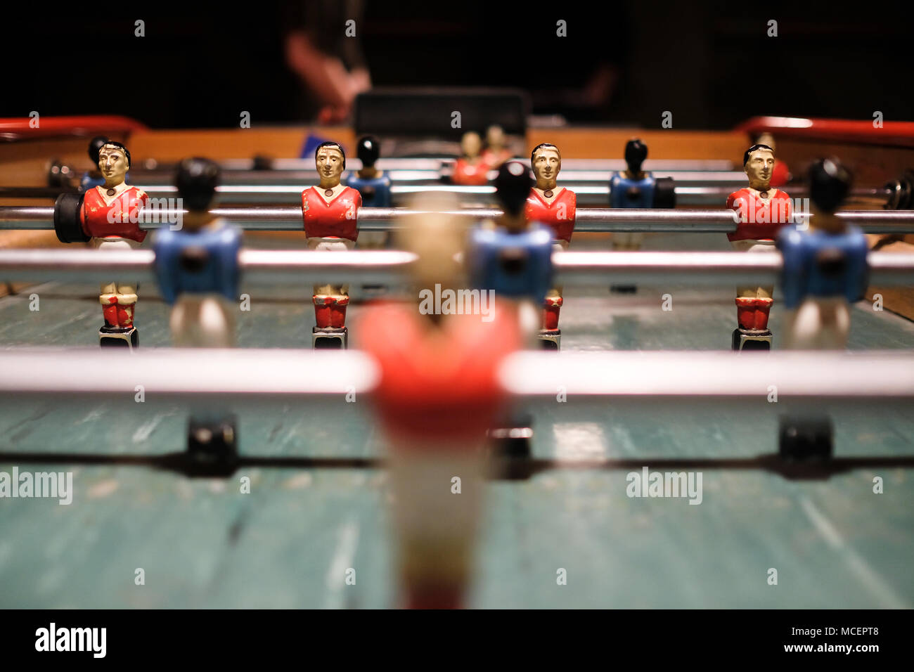 close up shot of a metal players on a vintage table football table ...