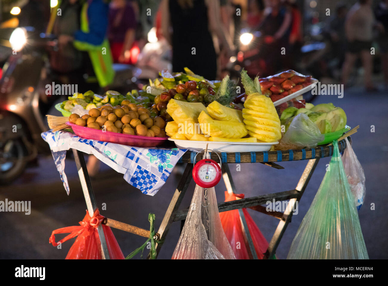 A display of street food for sale at a night market in the old quarter ...