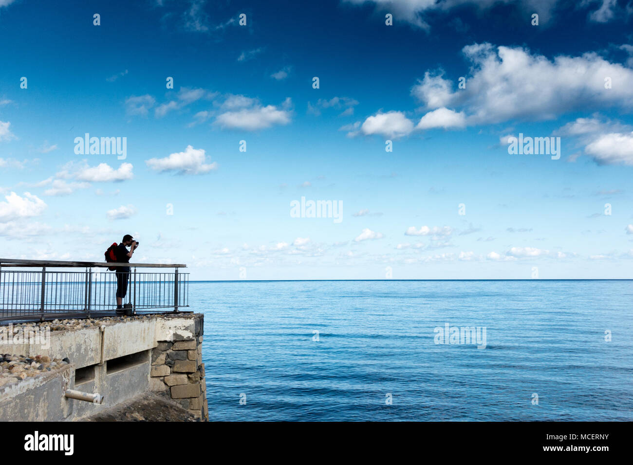 Seascape with rocks and long pier, Heraklion, Greece Stock Photo - Alamy