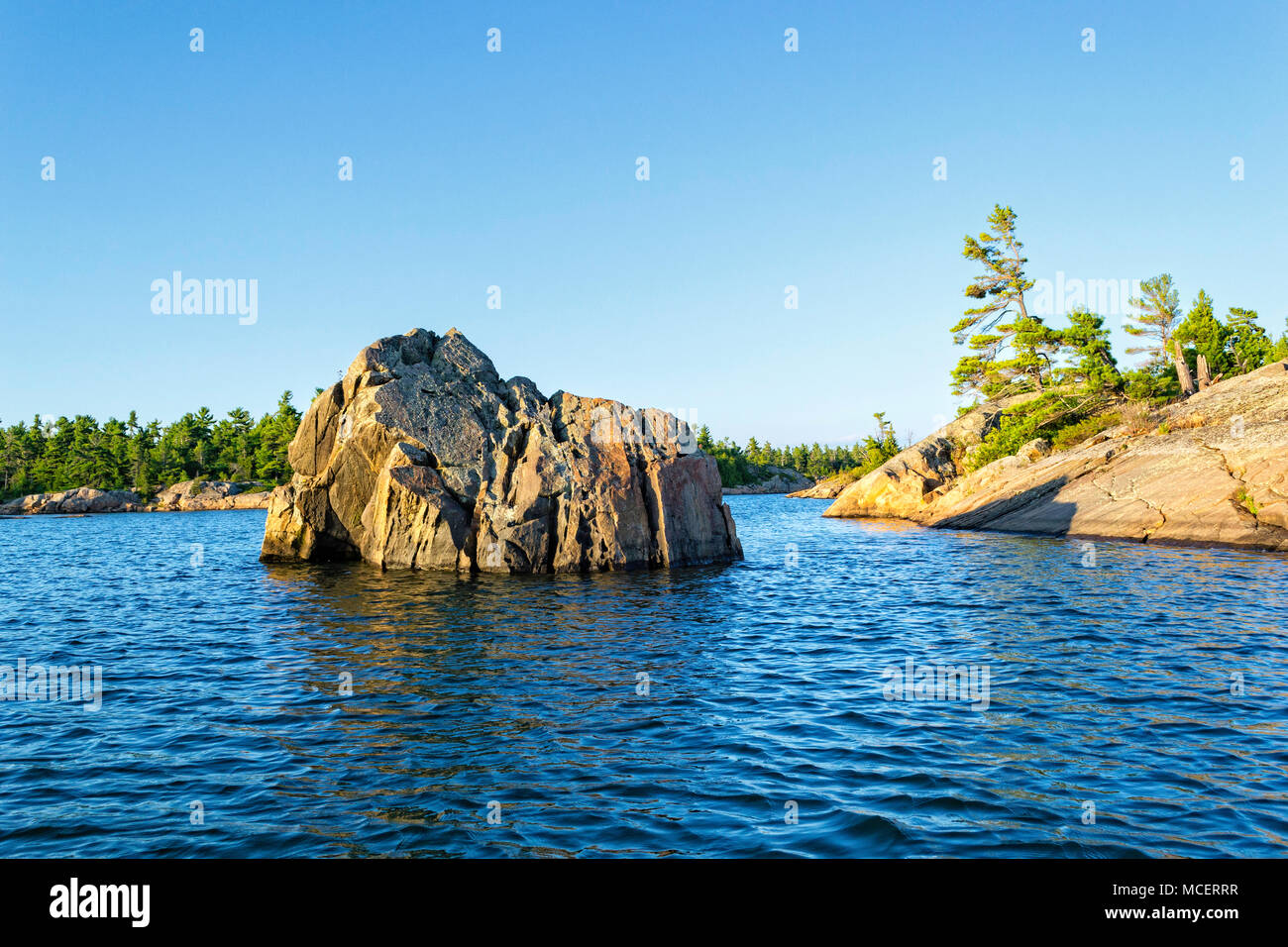A solitary rock in the middle of Black Bay,Georgian Bay Stock Photo - Alamy