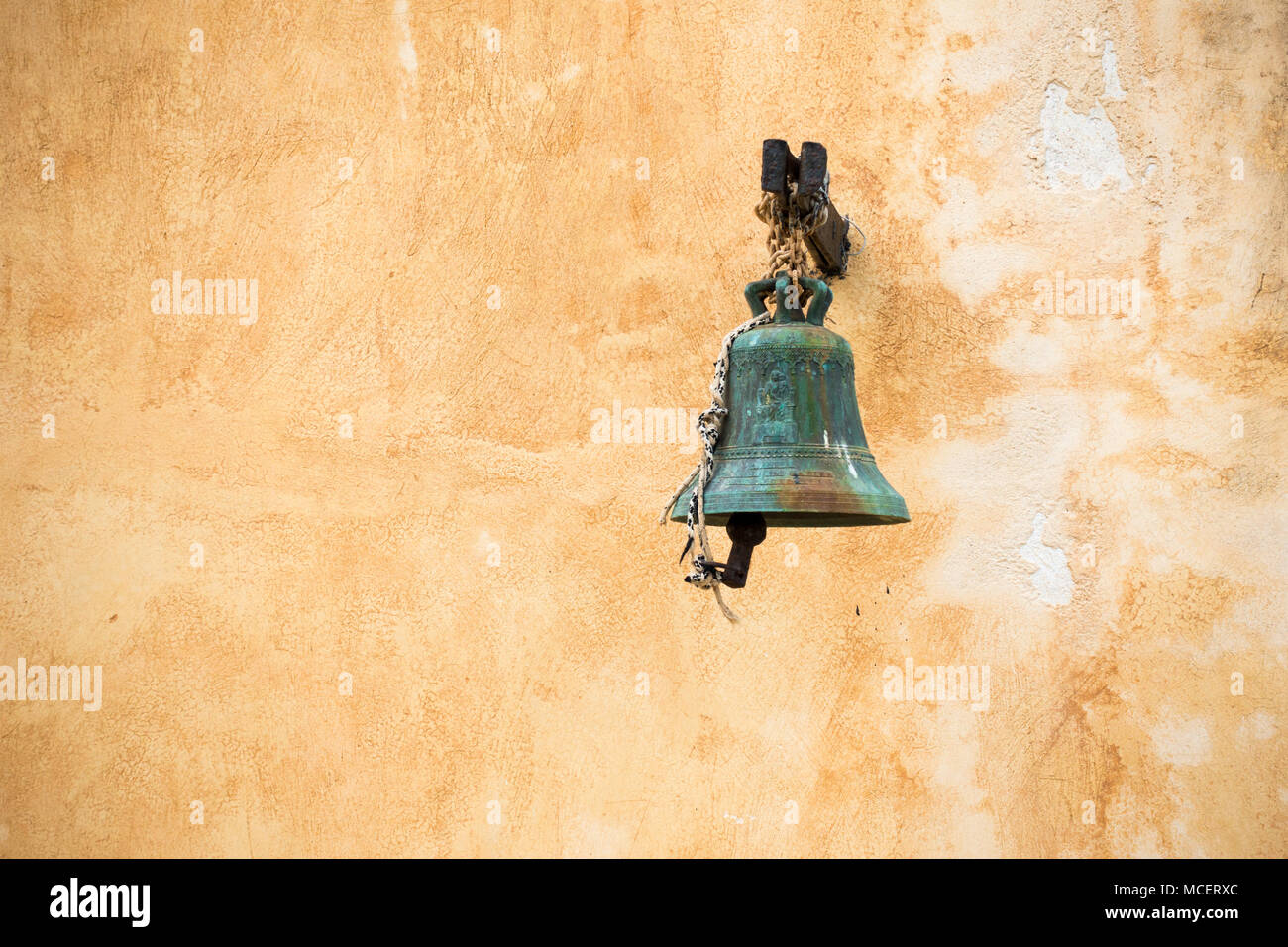 Church bell on wall in Spinalonga, Crete, Greece Stock Photo - Alamy