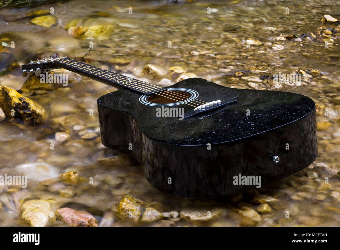 Guitar splashed by water hi-res stock photography and images - Alamy