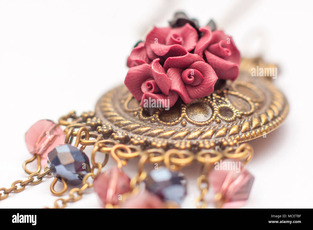Pendant with flowers made by hand Stock Photo - Alamy