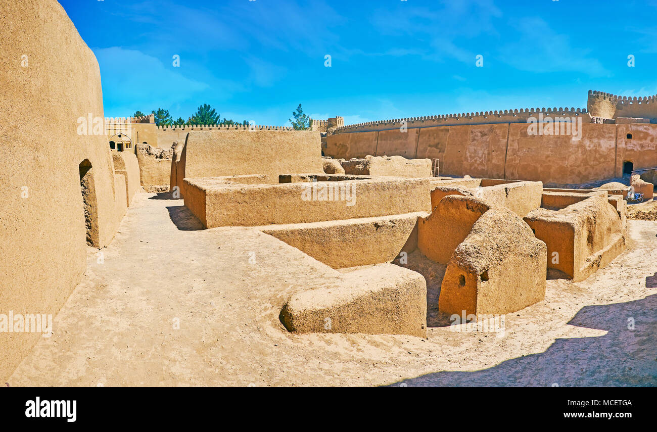 The walk among adobe ruins and tall ramparts of old Arg-e Rayen, well ...