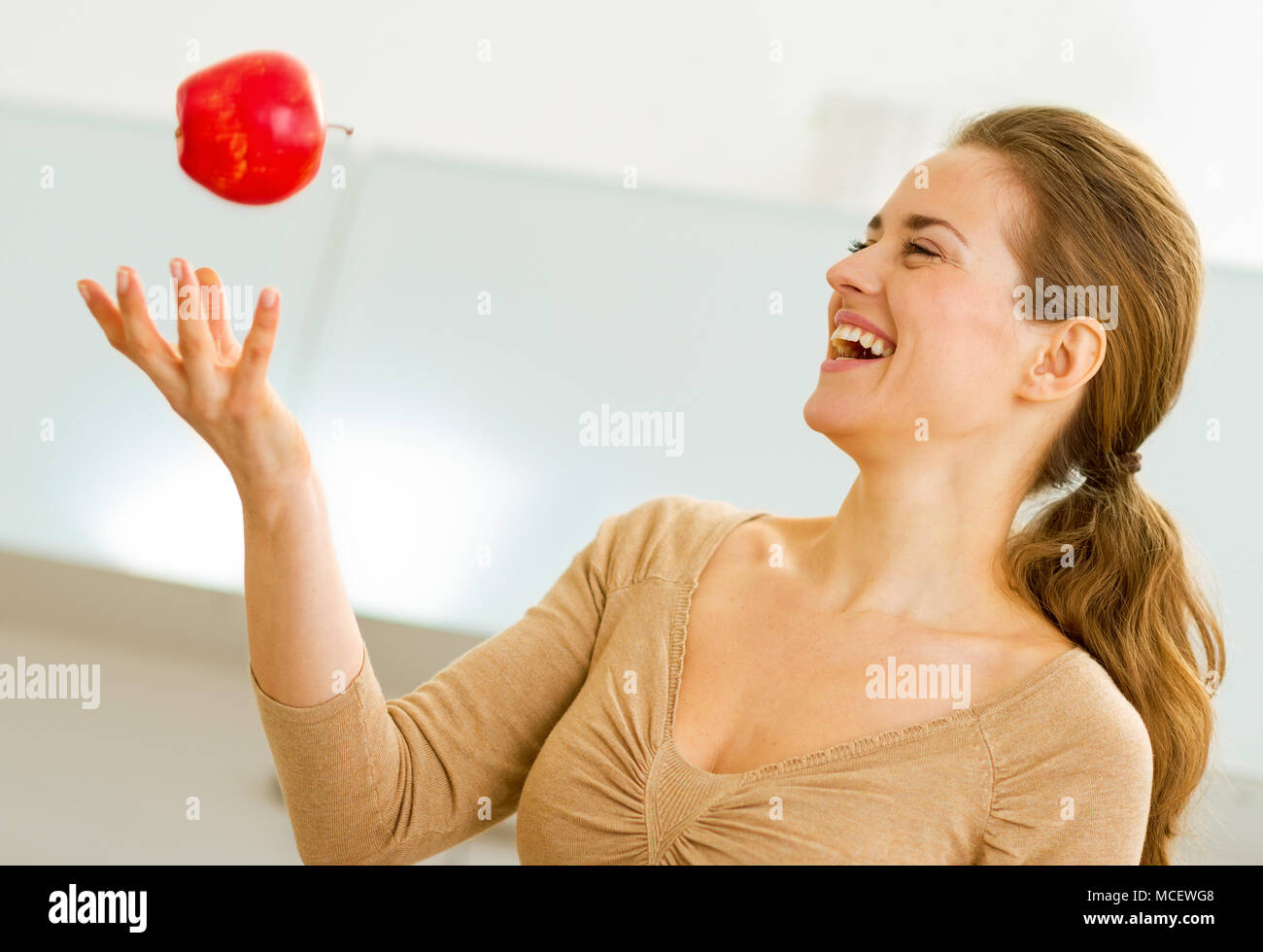 Throwing apple hi-res stock photography and images - Alamy