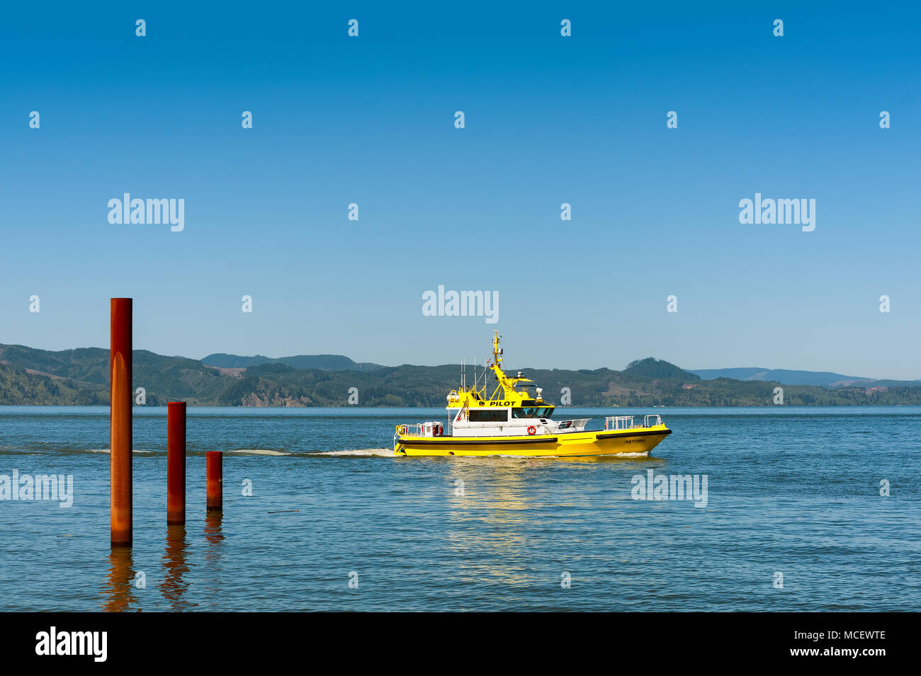 Astoria, Oregon, USA - April 7, 2016: A yellow pilot boat passesby on ...