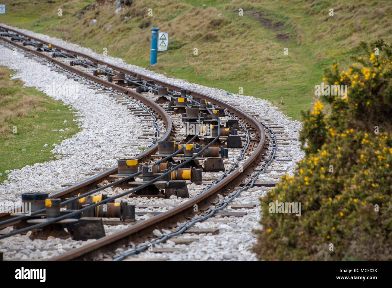 Close view of tram rail tracks showing the cable system which pulls the ...
