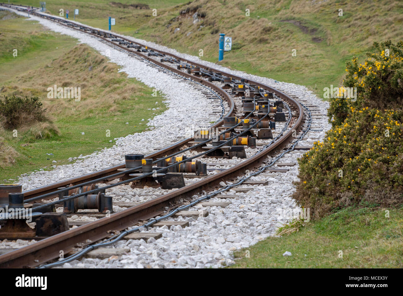 Close view of tram rail tracks showing the cable system which pulls the ...