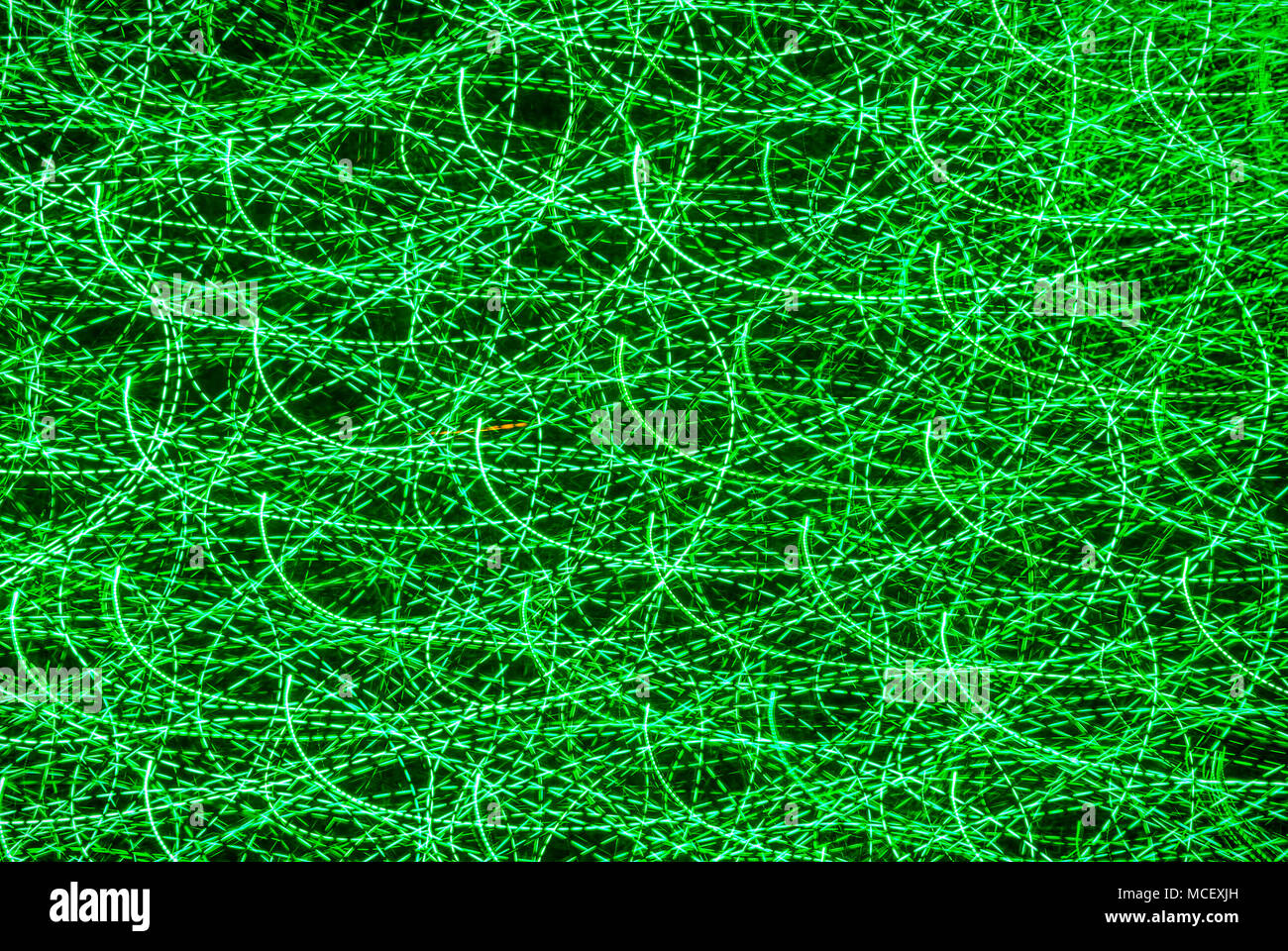 Background with green blurred magic neon light rays Stock Photo - Alamy