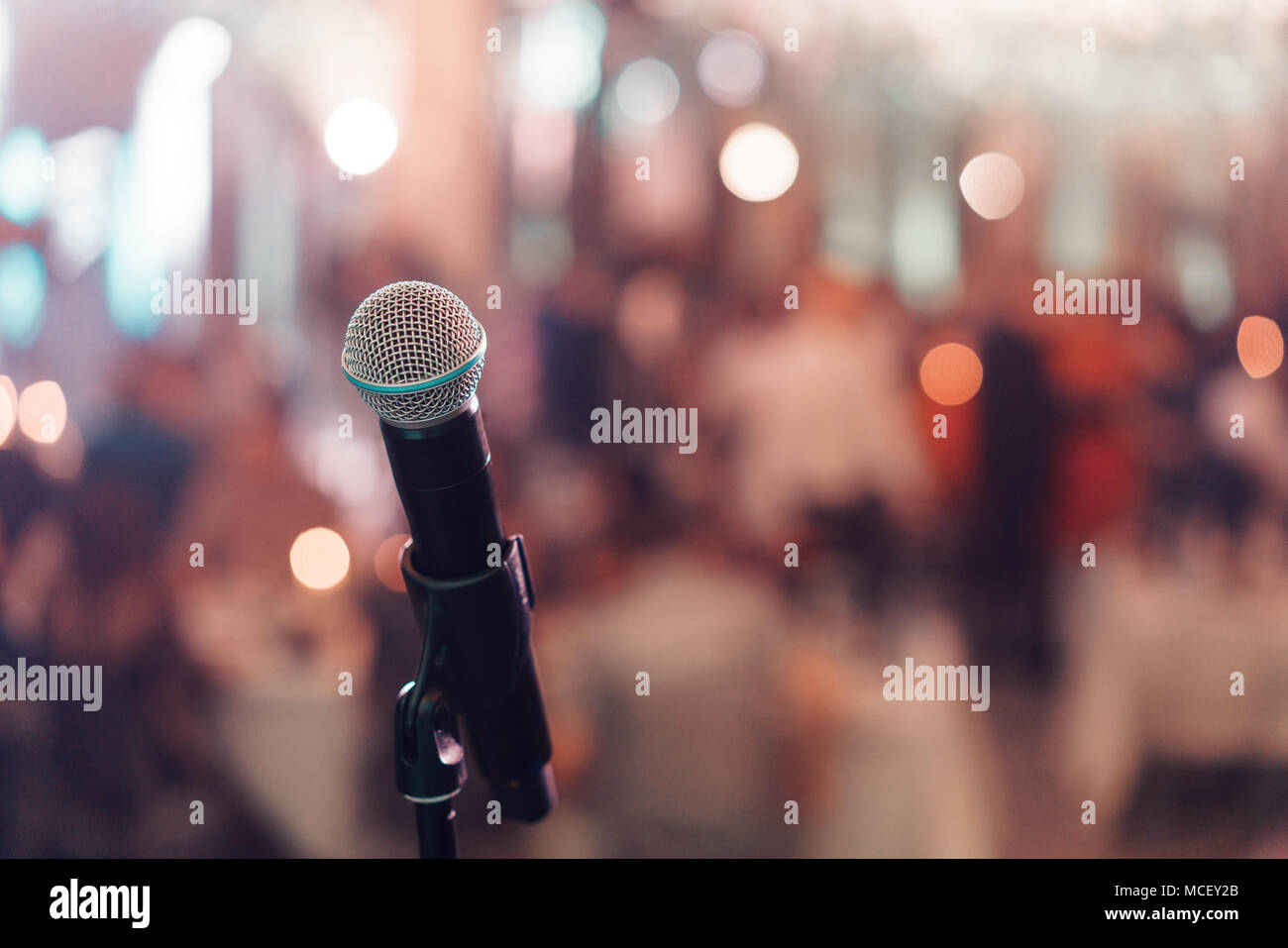 Close up microphone on stage in concert hall restaurant or conference ...