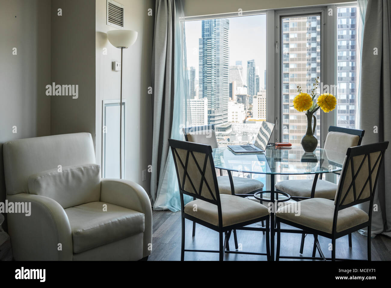 Interior of modern room with view of city from window Stock Photo - Alamy