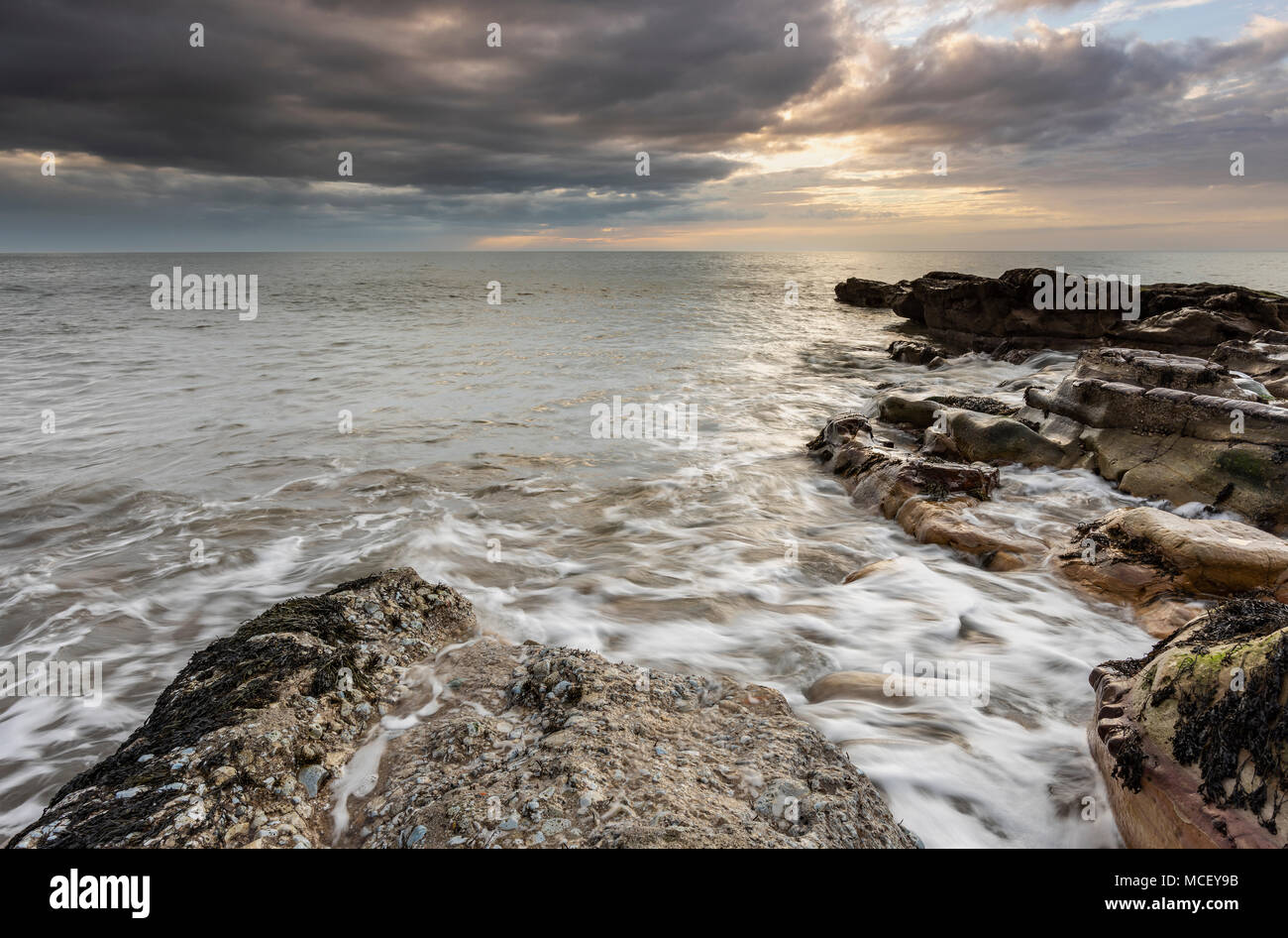 Rugged sunset off the Cumbrian West coast Stock Photo - Alamy