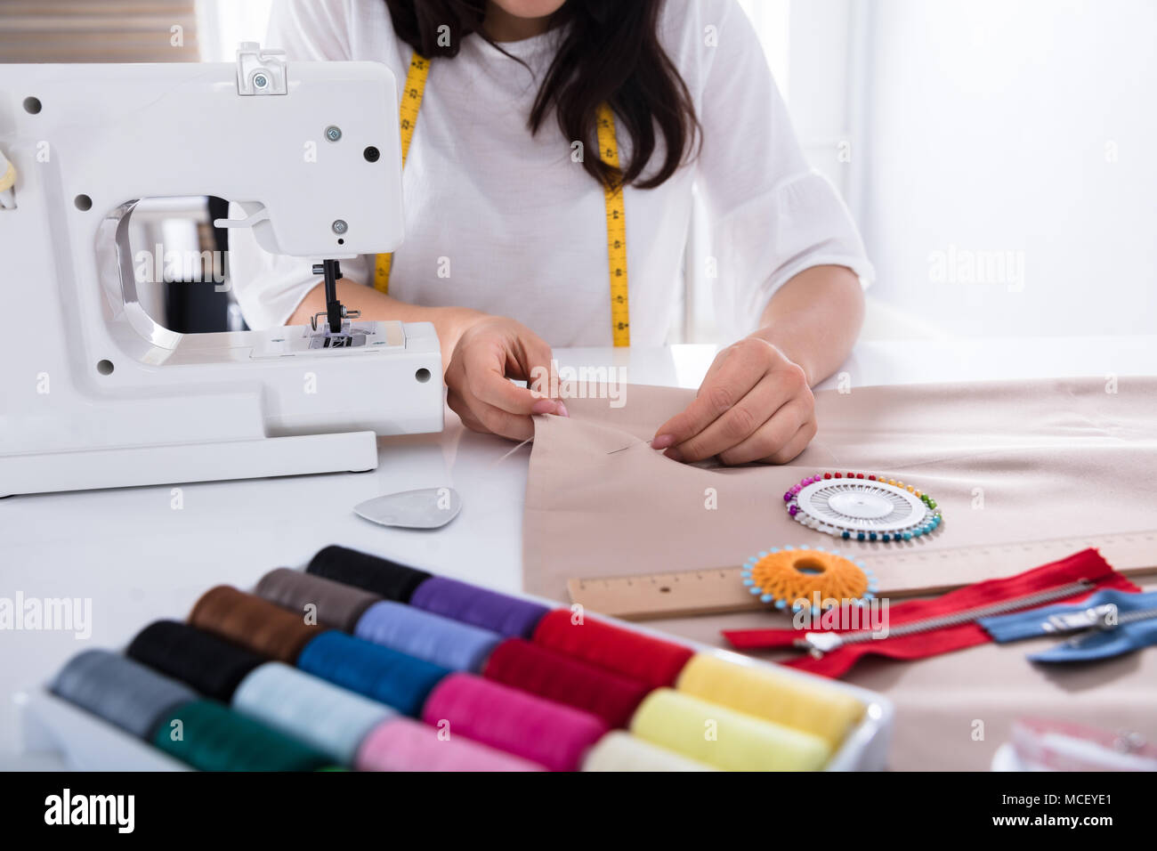 Tailor altering a dress hi-res stock photography and images - Alamy