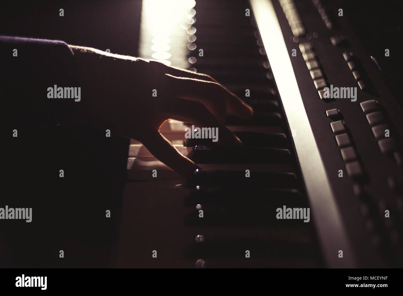 Musician playing keyboard in close hi-res stock photography and images ...
