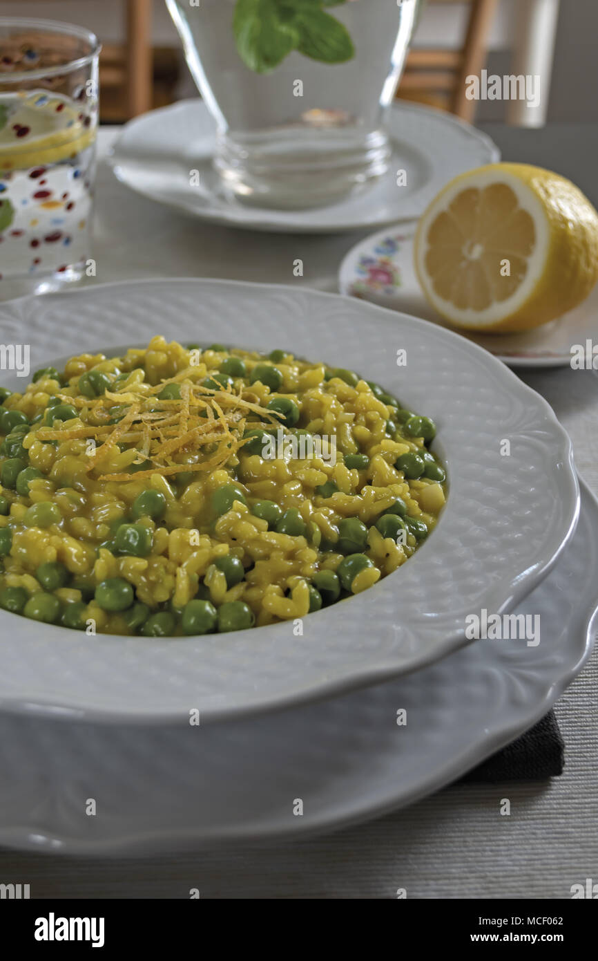 saffron risotto with peas 7 Stock Photo - Alamy