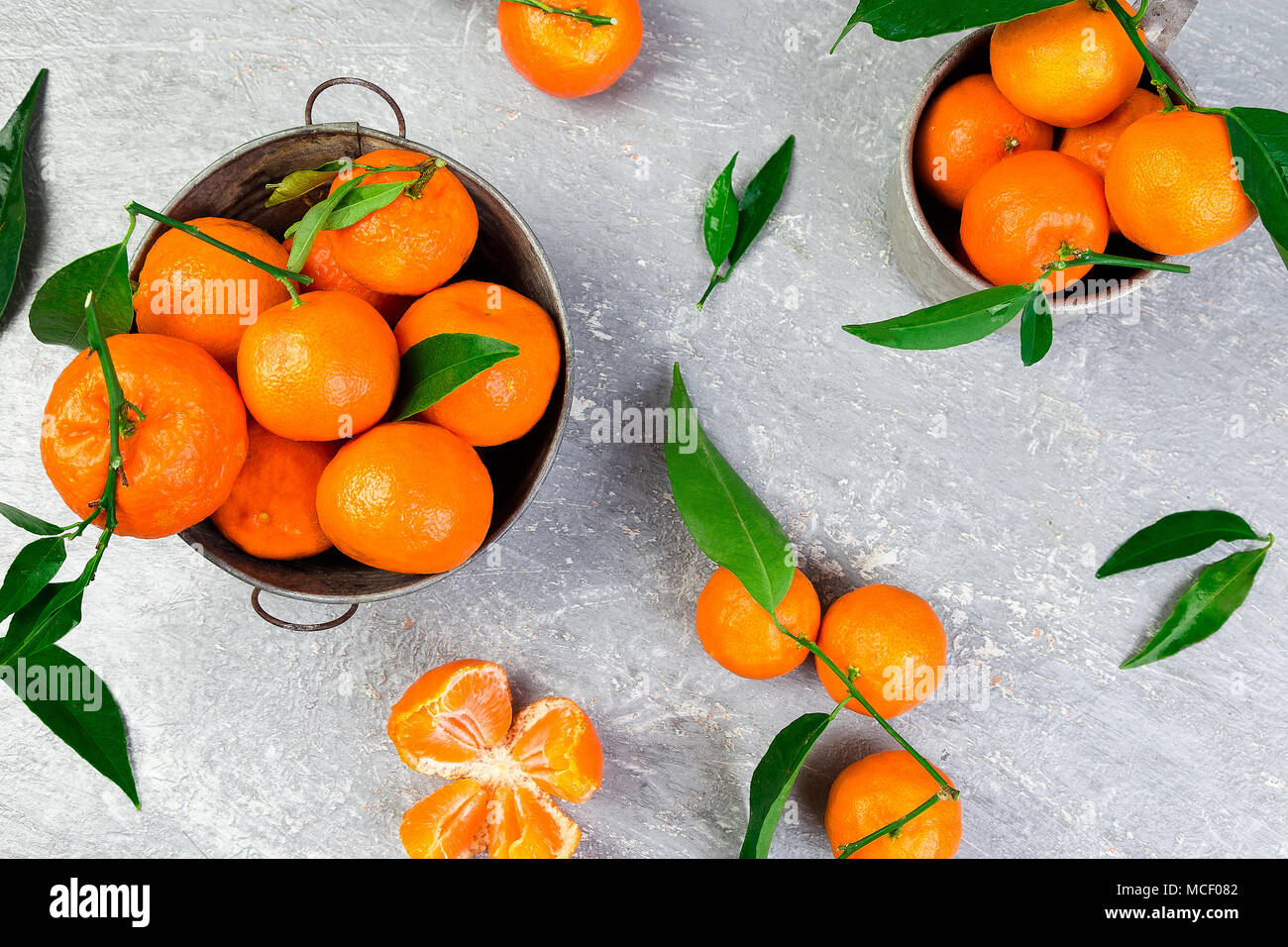 Fresh tangerines in the basket. Peeled and sliced Tangerine orange on a ...