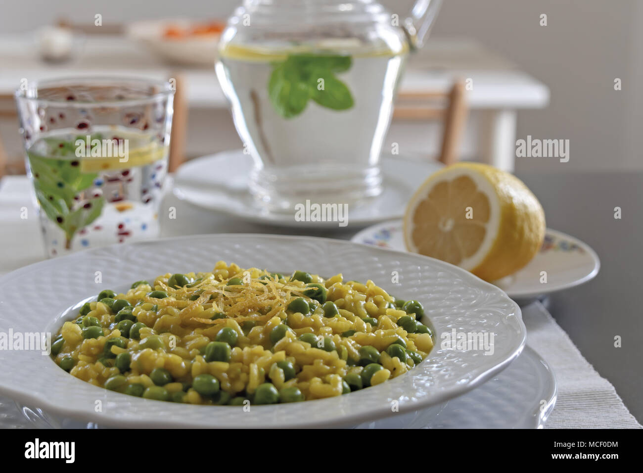 saffron risotto with peas 2 Stock Photo - Alamy