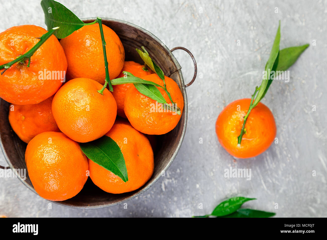 Fresh tangerines in the basket. Peeled and sliced Tangerine orange on a ...